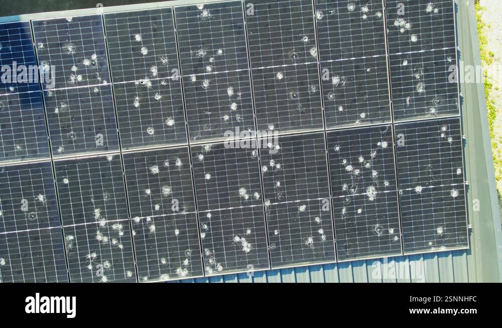Drone 4k footage of solar panels on a house roof severely damaged by a ...
