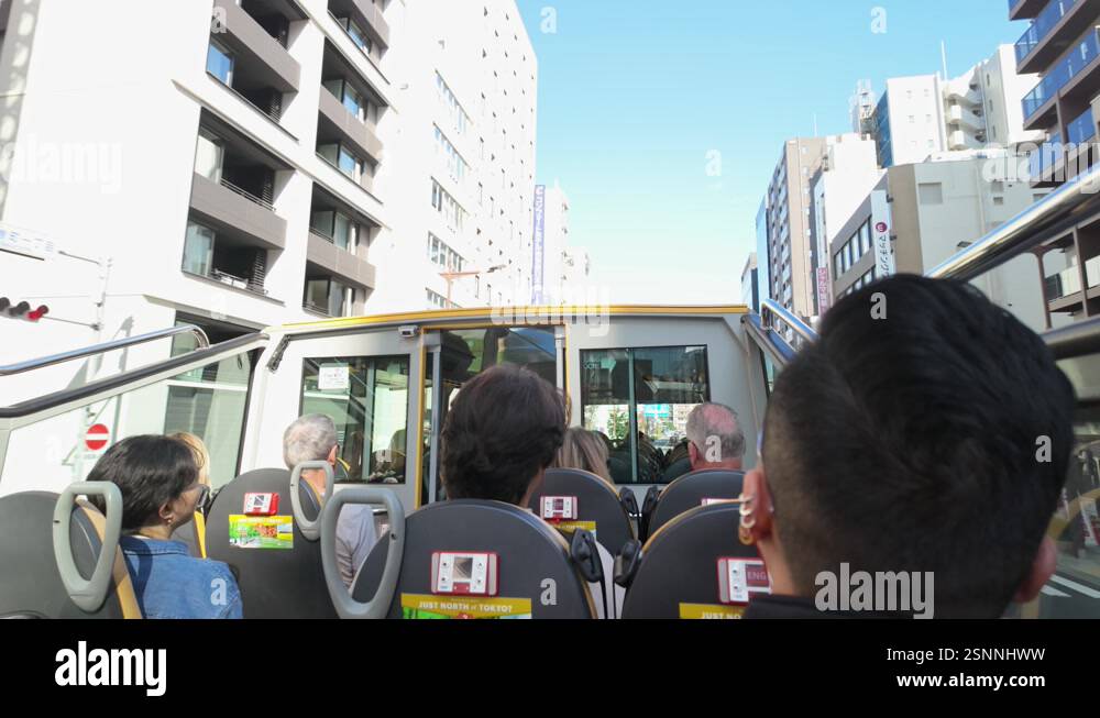 The open bus glides through Tokyo's urban maze, unveiling stunning ...