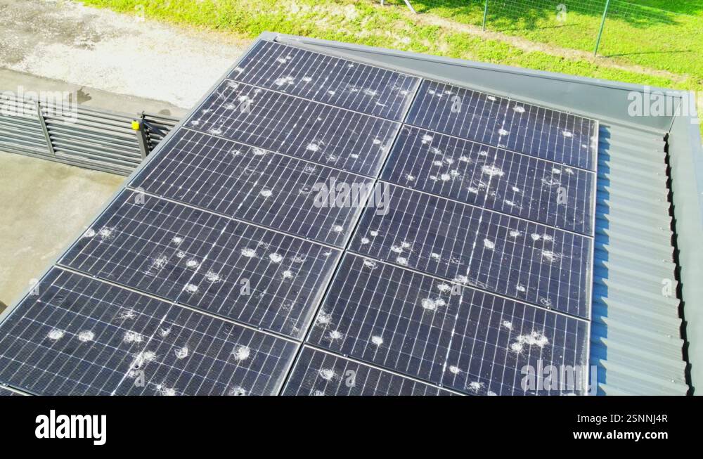 Drone 4k footage of solar panels on a house roof severely damaged by a ...