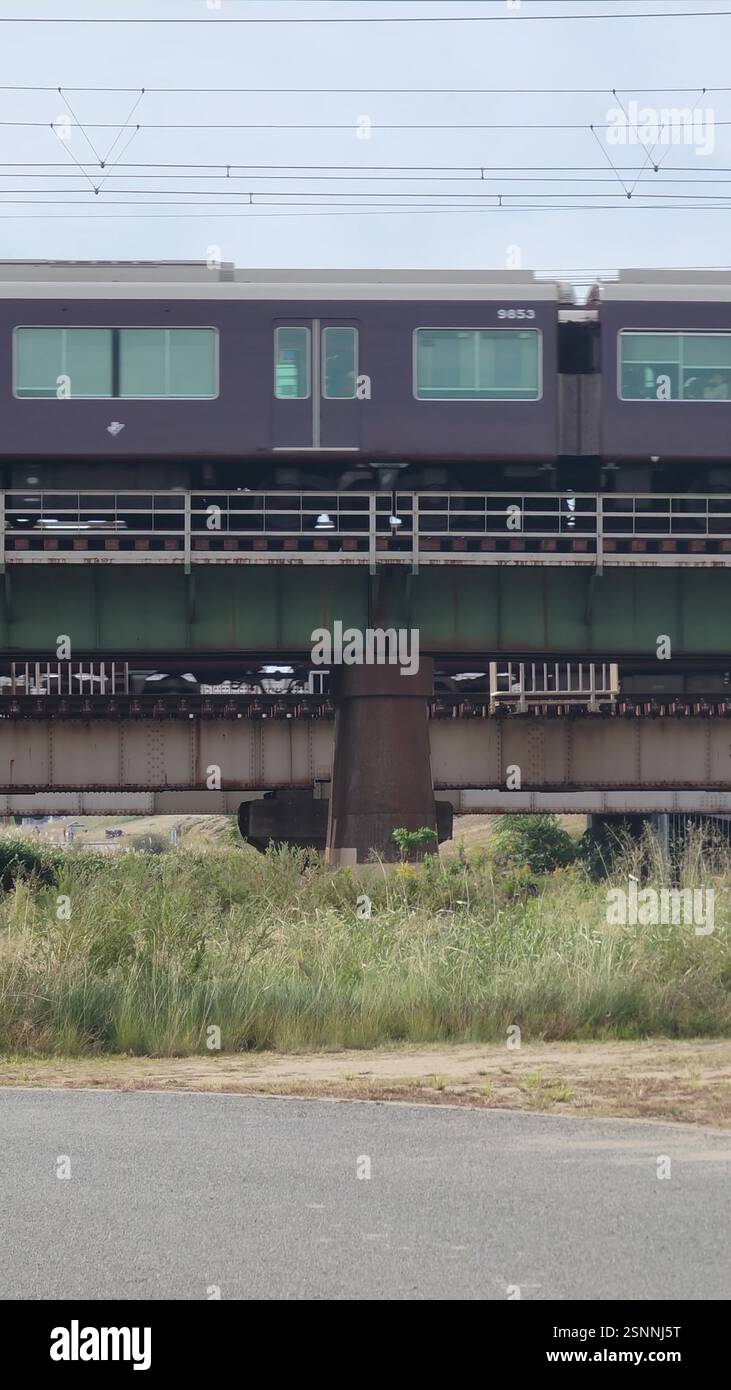 Train passing through urban railway bridge in japan osaka city 4k ...