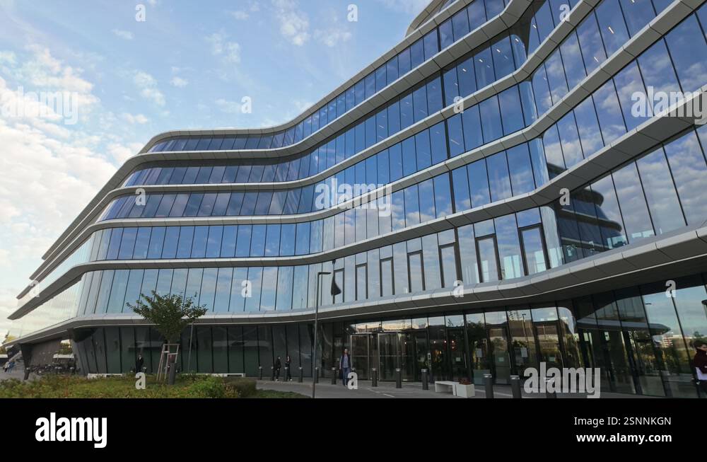 Glass-covered front side and main entrance of the Mol Campus office ...