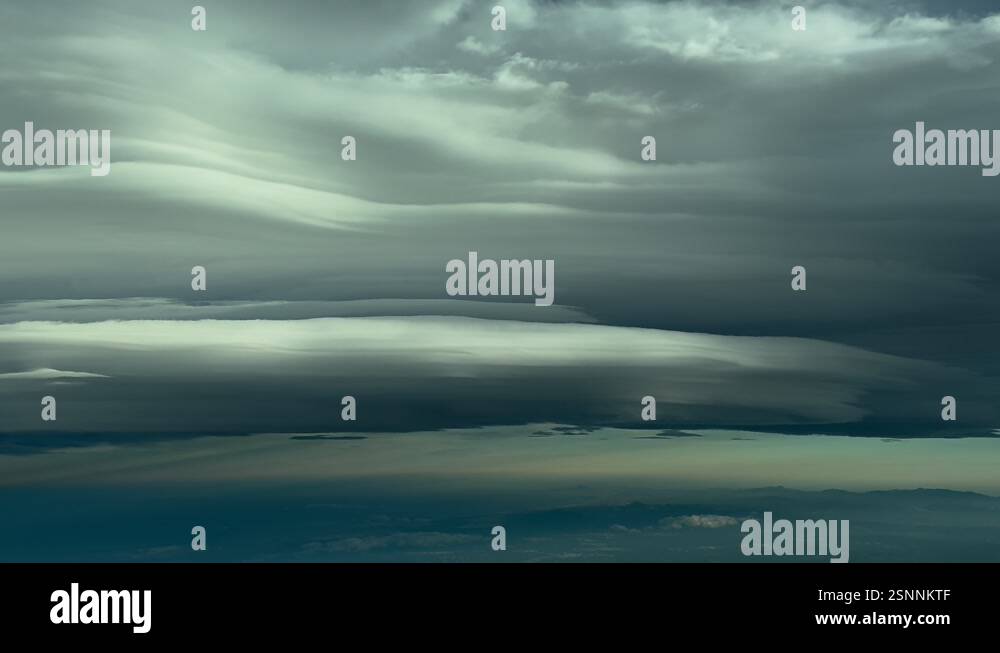 POV flying through a cold winter sky with waving cumulus clouds ahead as seen Stock Video ...