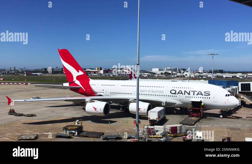 Qantas airbus a380 parked at airport gate being prepared for takeoff ...