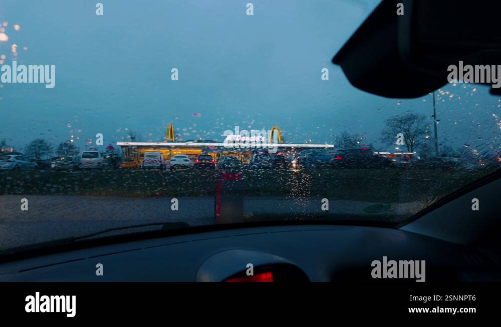 McDonald's Parking Lot at Night in Rain View from Inside Car Stock ...