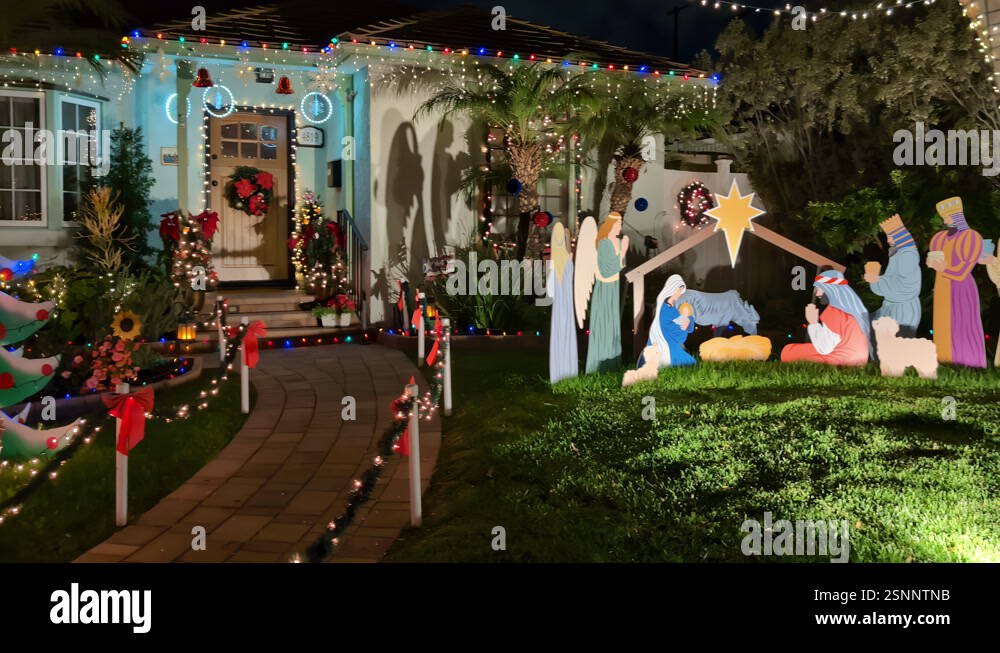 Nativity Scene in Front Yard with Festive Lights, Pan Right Shot Stock ...