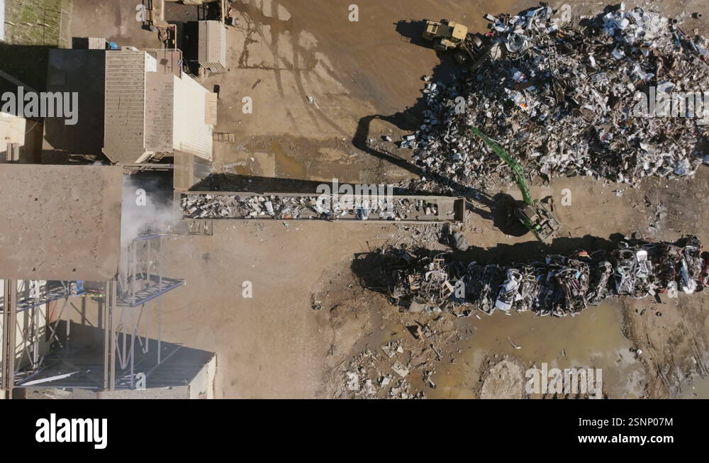 Static top down overhead aerial that moves closer footage of a backhoe ...
