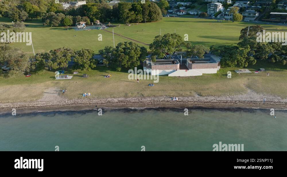 Park, beach, and water; people relaxing. Okahu Bay, Auckland, New Zealand Stock Video Footage ...