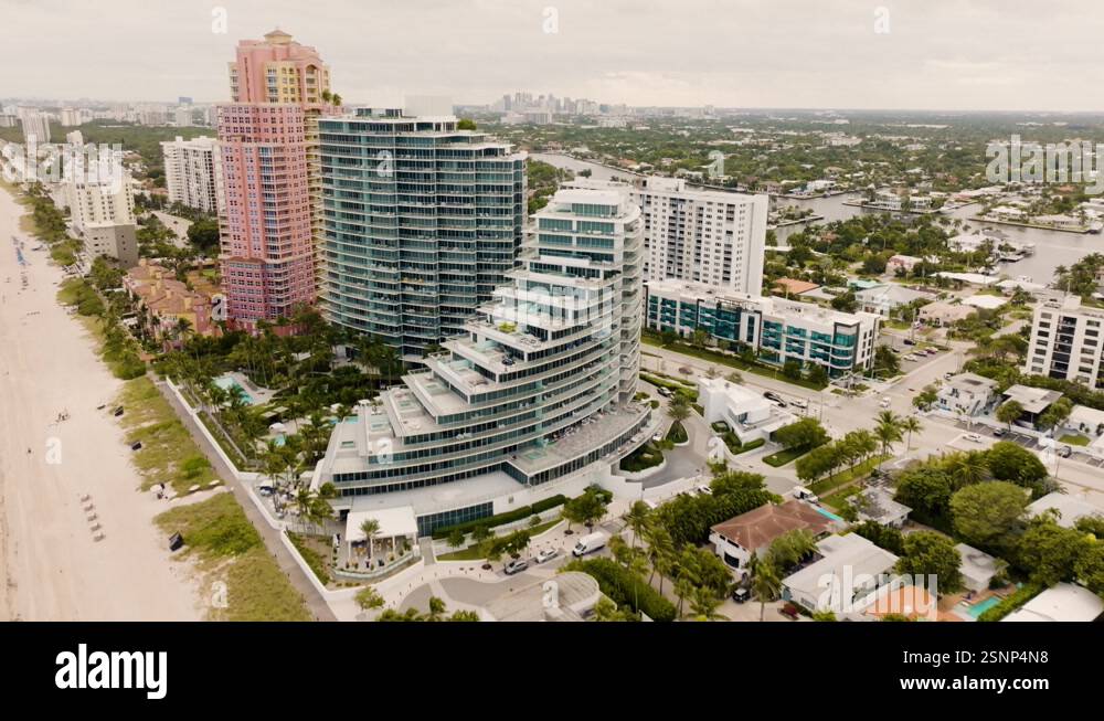 Tropical beach town with expensive high rise buildings overlooking the ...
