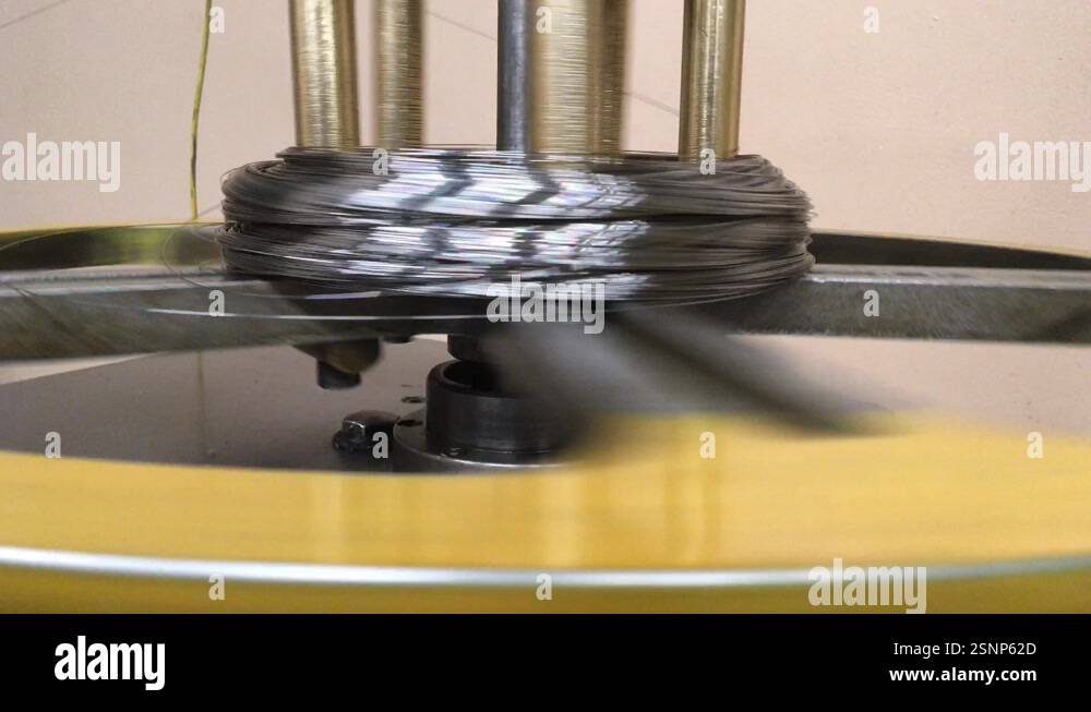Unwinding and feeding the wire into the straightening and cutting ...