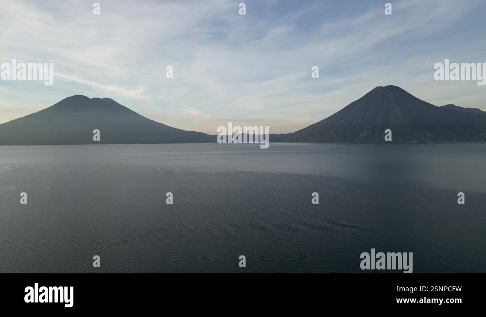Aerial shot over Lake Atitlan with views of the two volcanoes, Atitlan ...