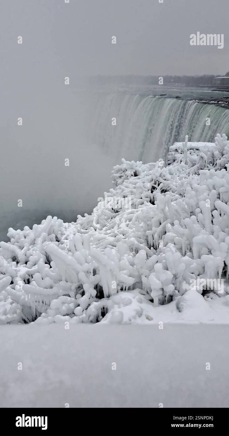 NIagara Falls Vertical with Ice Coated Fence and Waterfalls Stock Video ...