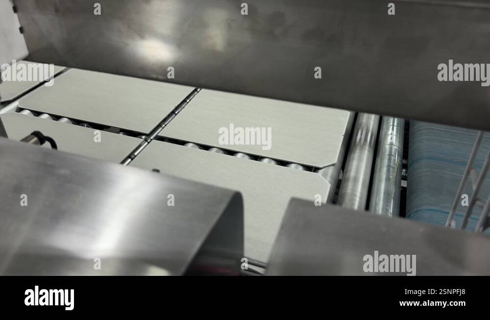 Factory automation Fibre cement sheet pieces moving along automated ...