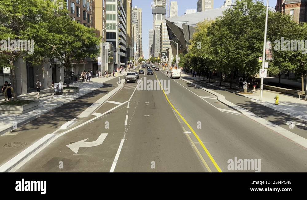 Rear View of a Bus Driving Down a Bustling Street in Downtown Toronto ...