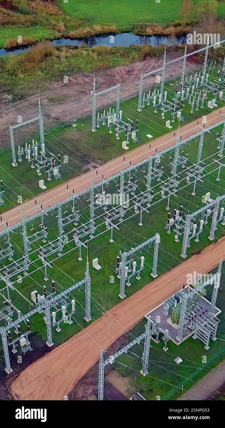 Electric power utility station with high voltage wires, residential ...