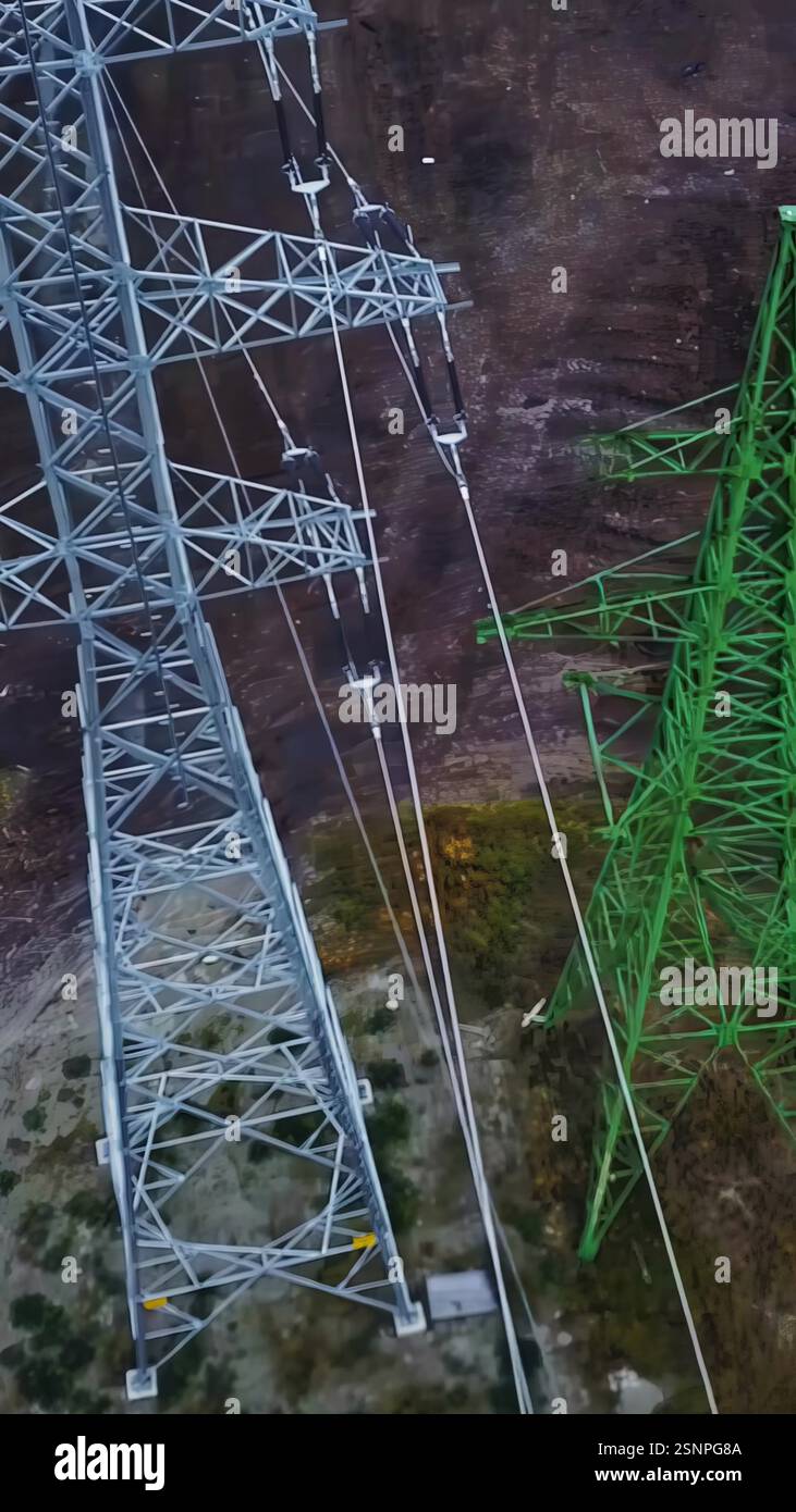 Electric power line towers with high voltage high tension lines, drone ...