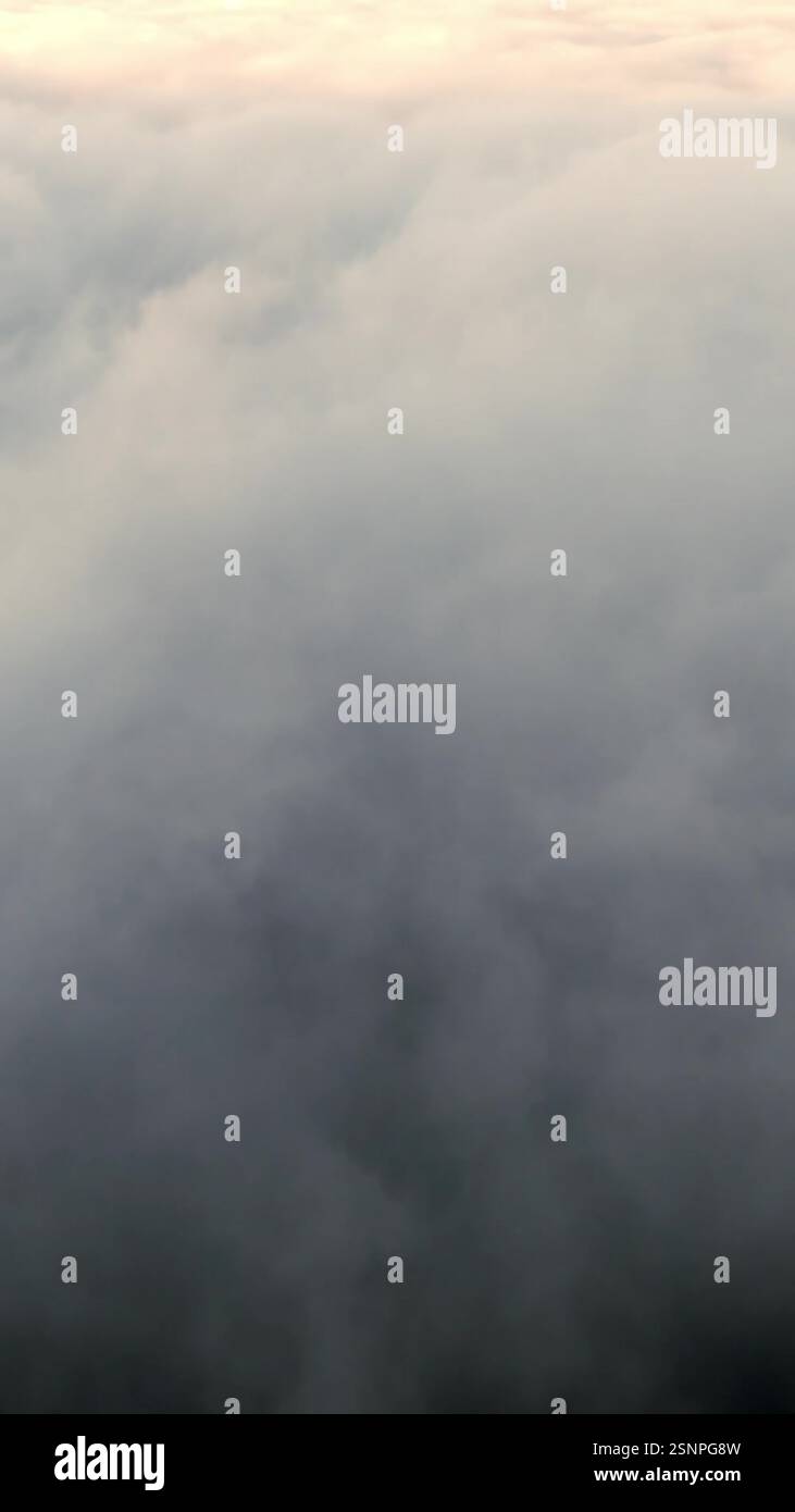 Aerial vertical above tropical stormy clouds cloudscape white texture ...