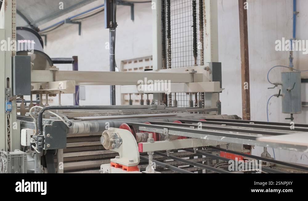 ceramic tiles going to the heating section by conveyor line, industrial ...