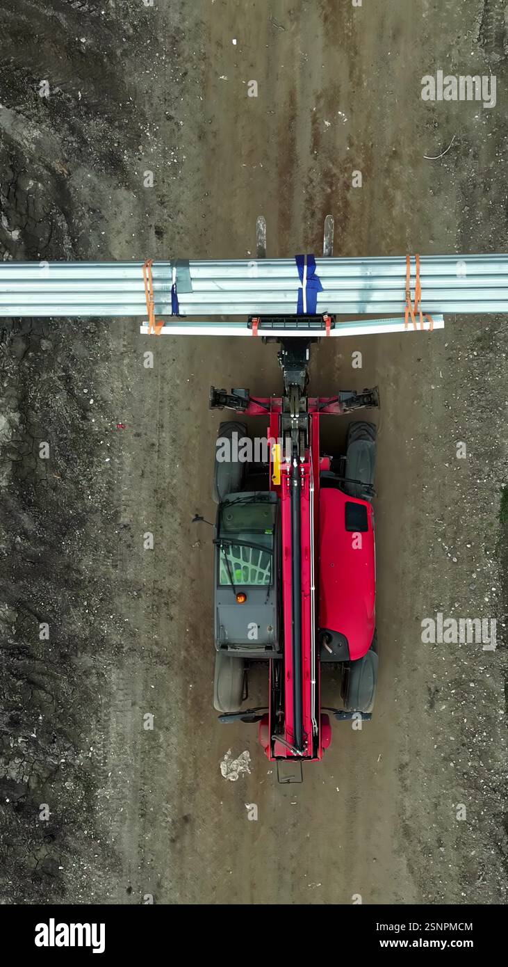 Heavy equipment vehicle on construction site moving, drone tracking ...