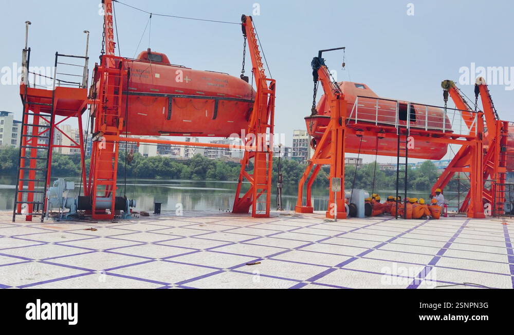 Davits lowering lifeboats during maritime safety drill in india Stock ...