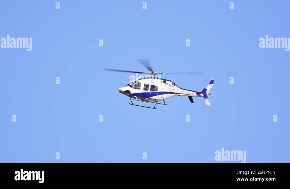 An Abu Dhabi Police helicopter patrols the skies over Abu Dhabi, United ...