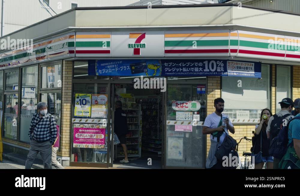 Customers Walk in and out of 7 Eleven Convenience Store in Typical ...