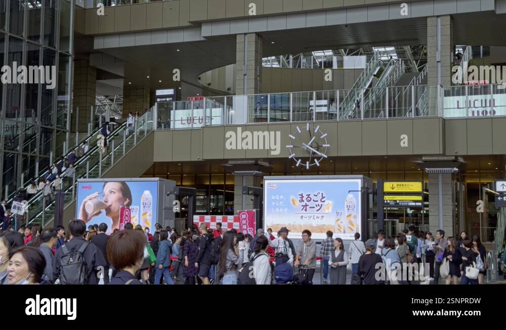 Busy Atrium at Osaka Station as People Move in Foreground on Busy Day ...