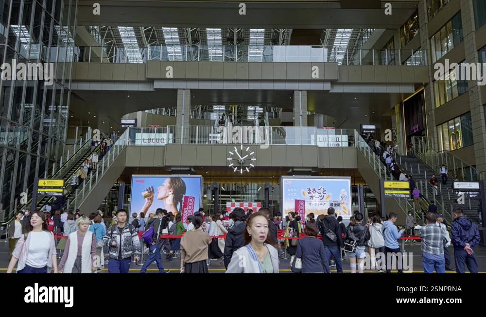 Busy Osaka Station Atrium as People Walk Quickly to get to their ...