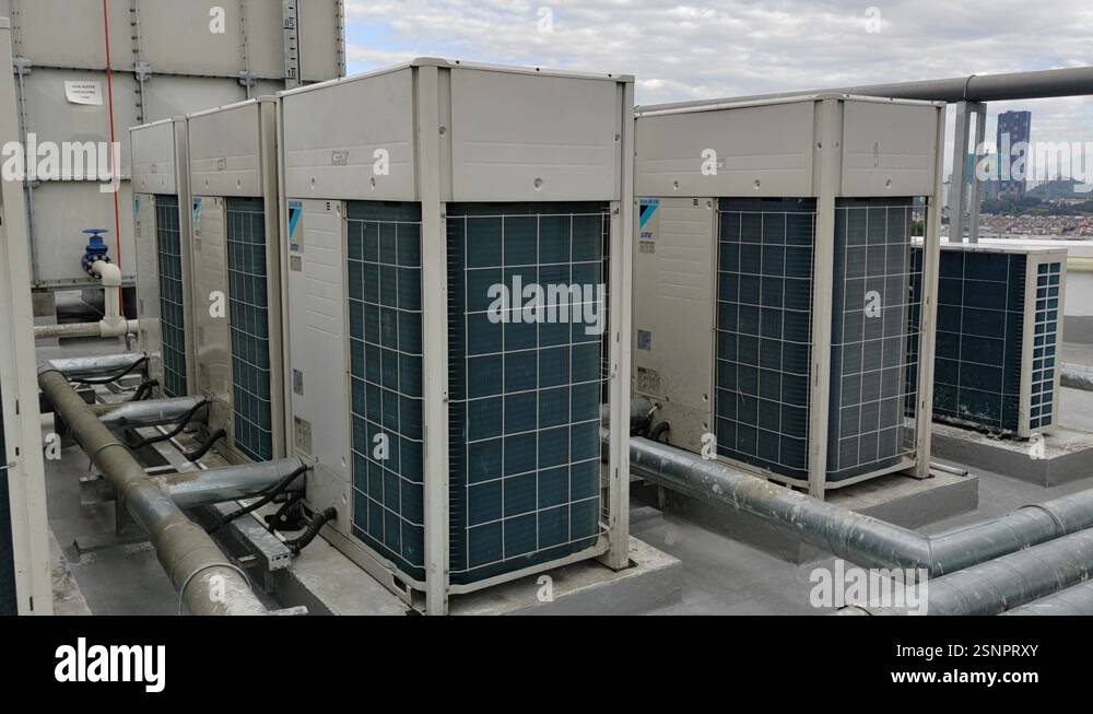 An outdoor air conditioning unit installed outside a building Stock ...