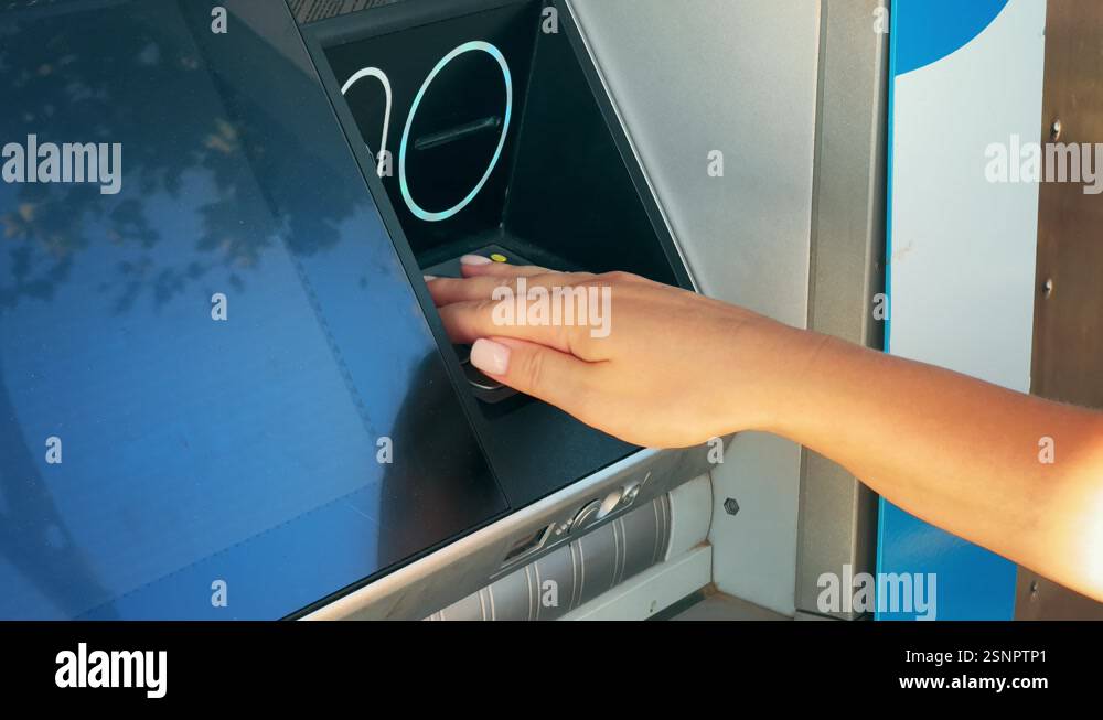 ATM Banking. Enter pin code in cash machine. Close up of person typing ...