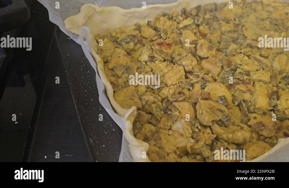 Dough on a baking sheet with filling. Step-by-step preparation of the ...
