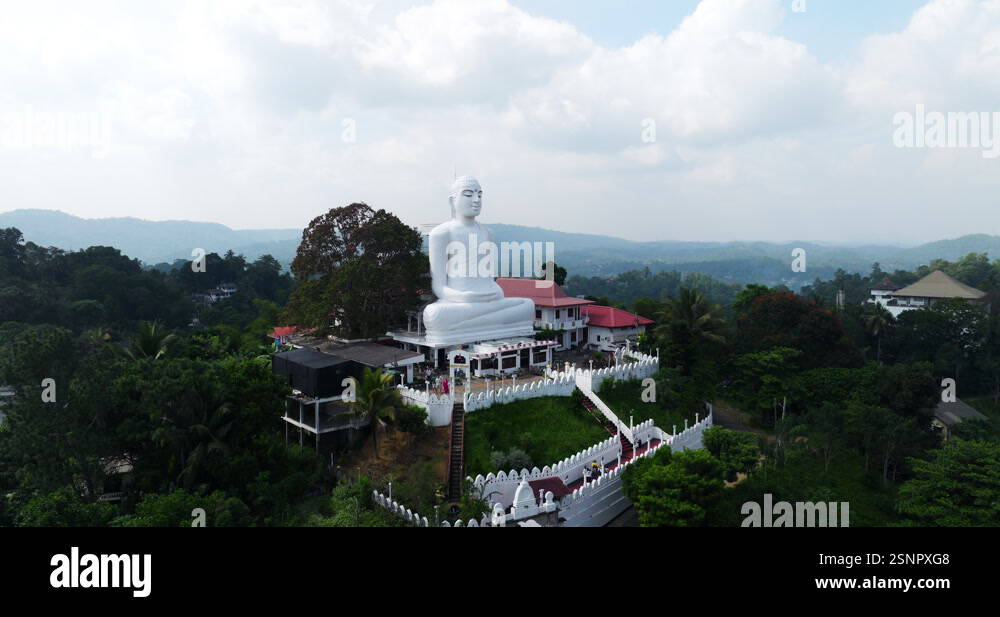 Buddha Statue Of Sri Maha Bodhi Viharaya In Kandy, Sri Lanka. - aerial ...