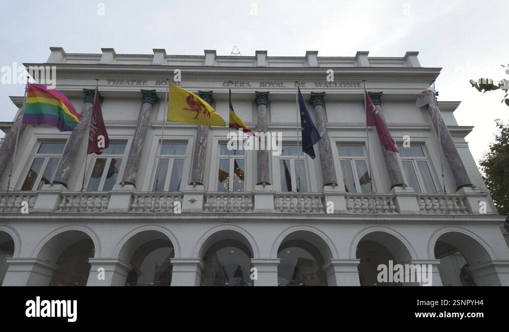 Elegant facade of the Opéra Royal de Wallonie-Liège with flags and ...