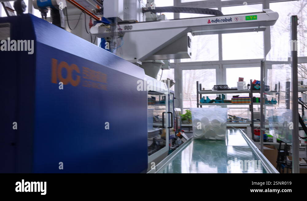 Factory machinery in operation inside a modern industrial facility with ...