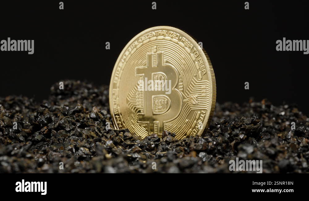 A Bitcoin Coin Balancing on Black Stones, Slowly Rotating to Showcase ...