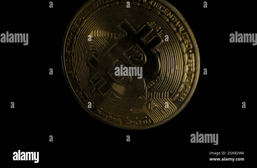 The Camera Slides and Gradually Zooms In On a Spinning Bitcoin ...