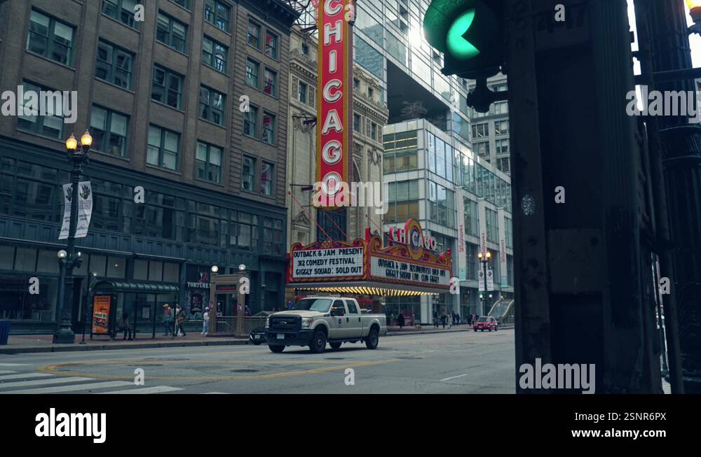 Tilt up from corner street view showcasing iconic Chicago marquee and ...