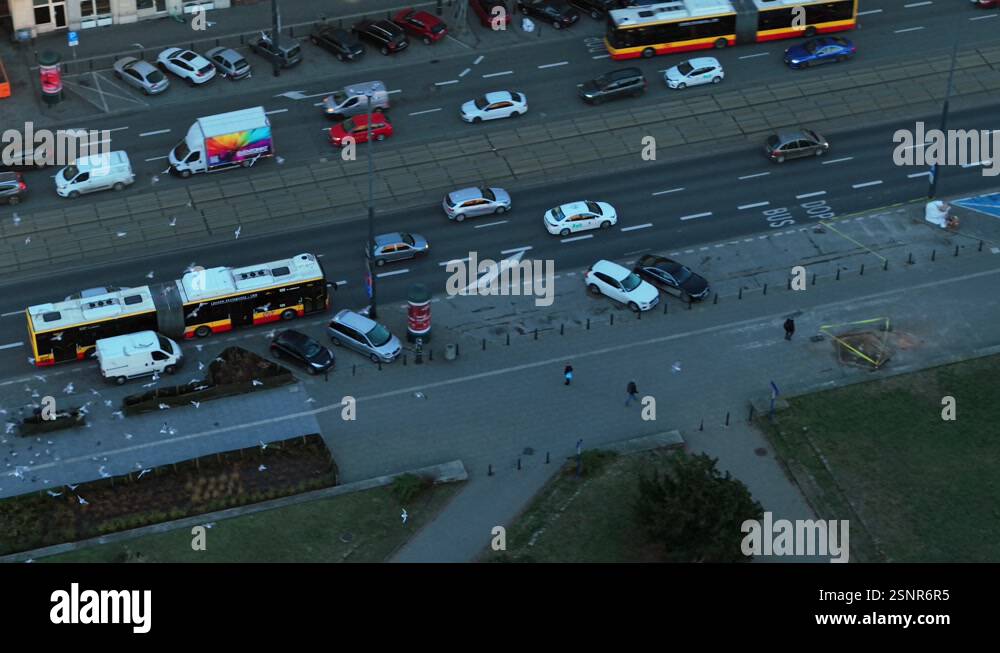 Busy urban streets with tram, bus, and cars driving in morning Stock ...