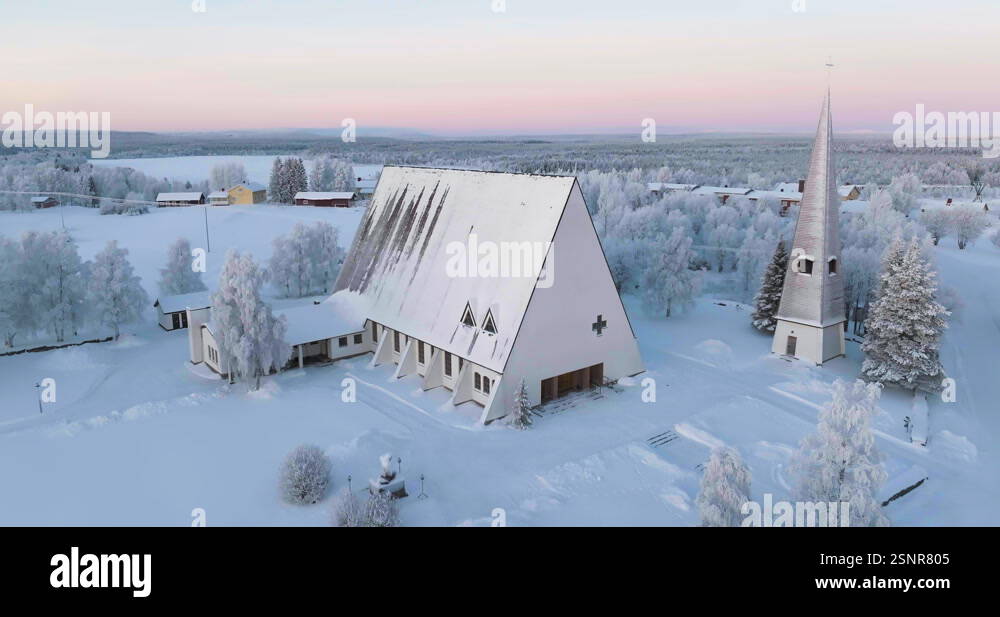 Aerial view of the frozen facade of the Salla church, polar night in ...
