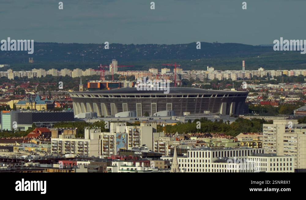 The enormous building of the Puskas Arena rises above the residential ...