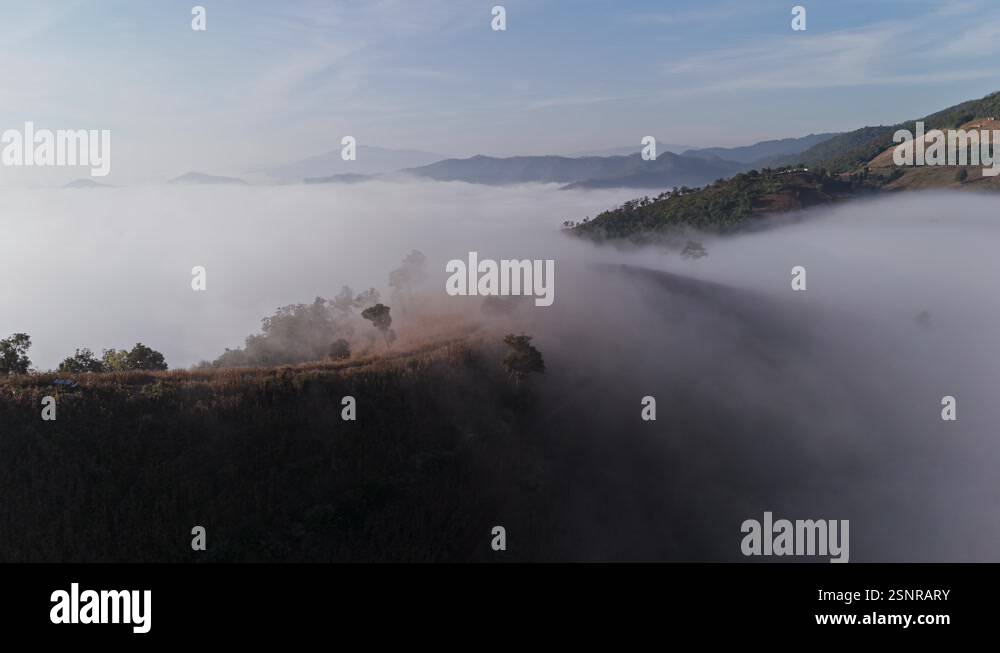 A stunning drone flight over mist-covered mountains in Mae Chaem ...
