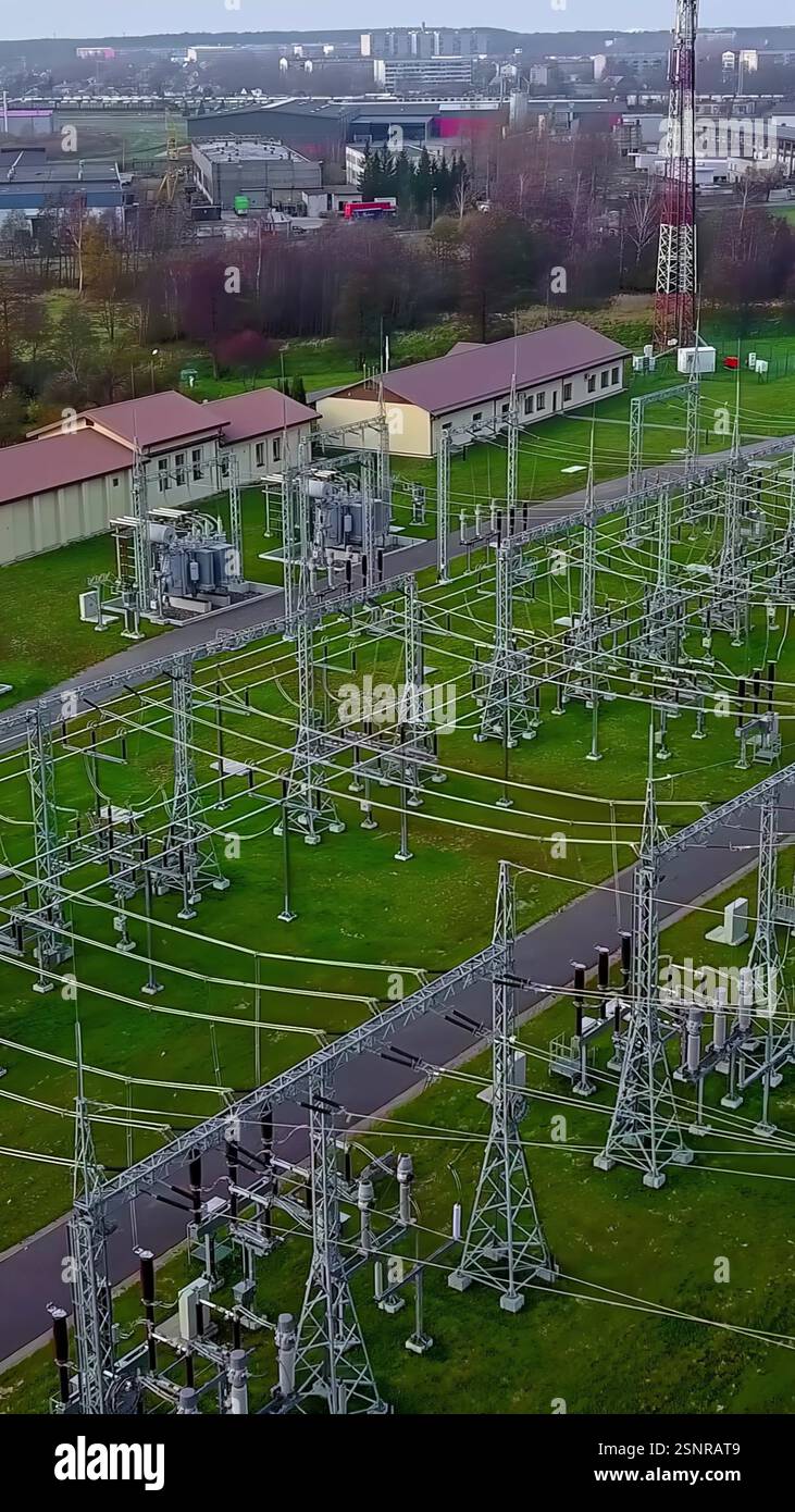 Transformers and electric power lines at energy substation, vertical ...