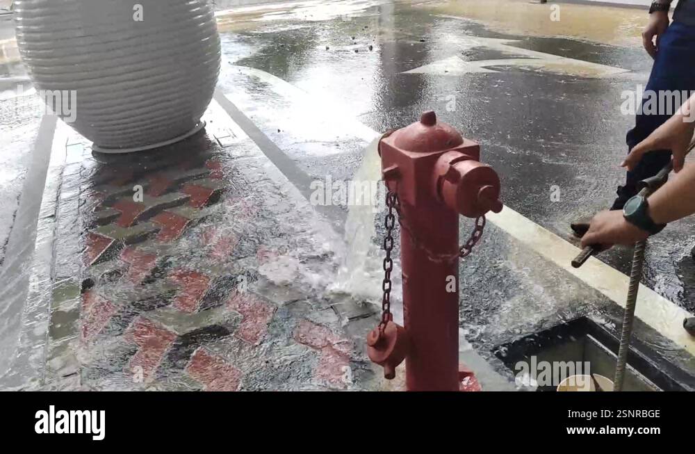 A fire hydrant bursts open, releasing high-speed water in large volumes ...