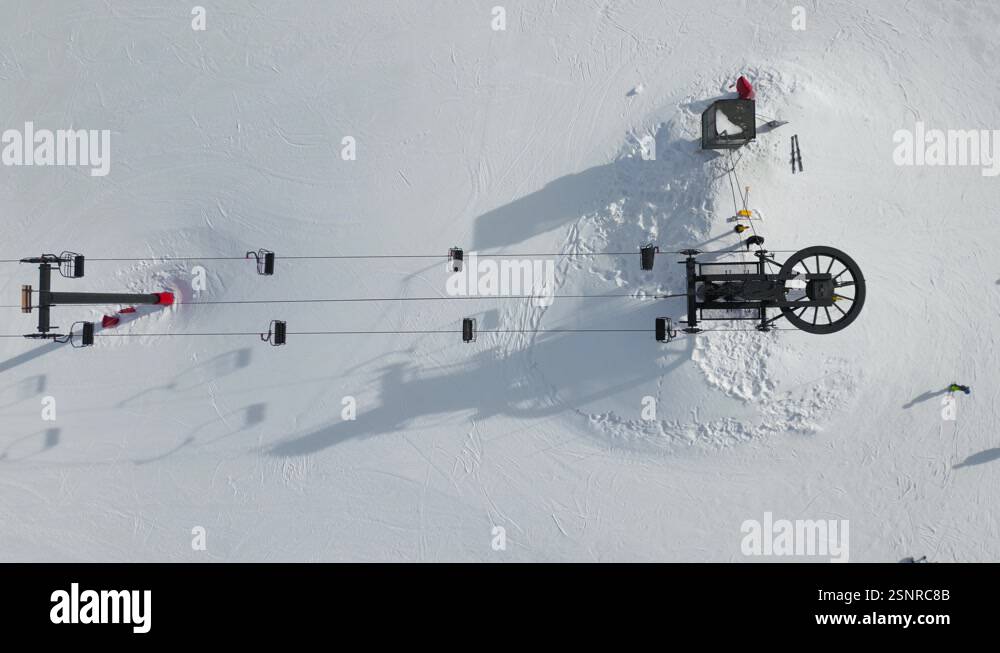 Ski Lift with Chairlifts Operating on Snowy Mountain Slope at Ski ...