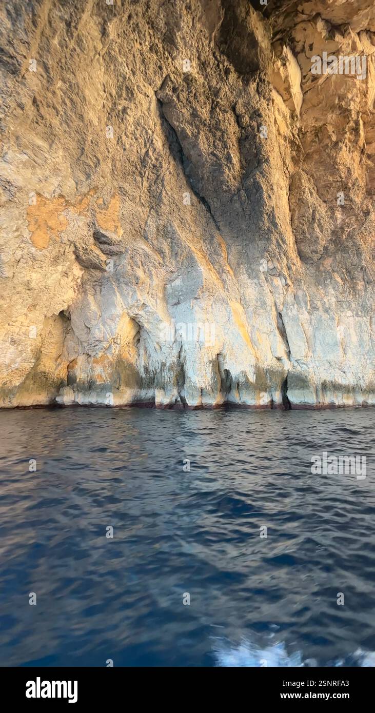 Passing through the Blue Grotto arched rock formation on Malta's south ...