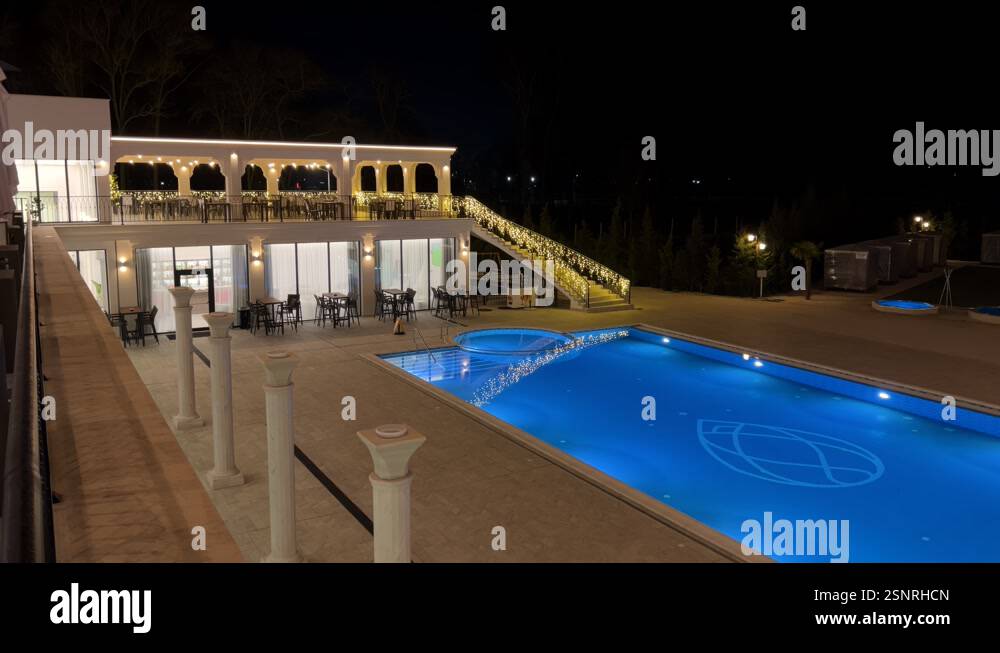 Evening view of the outdoor pool of the spa hotel Grand Resort Pavel ...