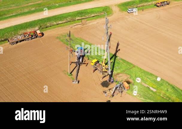 Installation of power line pylon using construction equipment and ...