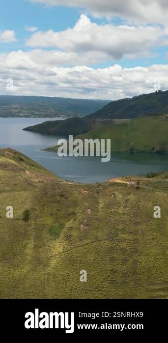 Lake Toba is located in the crater of a volcano and mountains. Sumatra ...