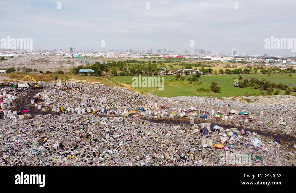 Waste management at toxic landfill with Downtown cityscape skyline ...