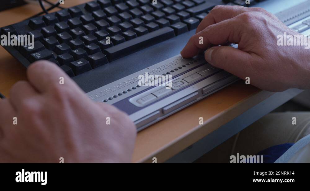 Reading a braille display for the blind with a finger, focusing on ...