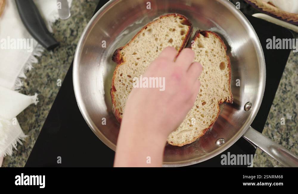 Two Slices of Artisan Bread Toasting in a Skillet for Breakfast ...